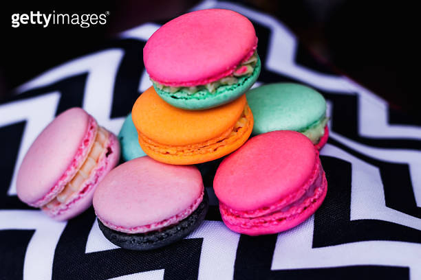 tasty biscuits of round shape and different colors with a delicate ...