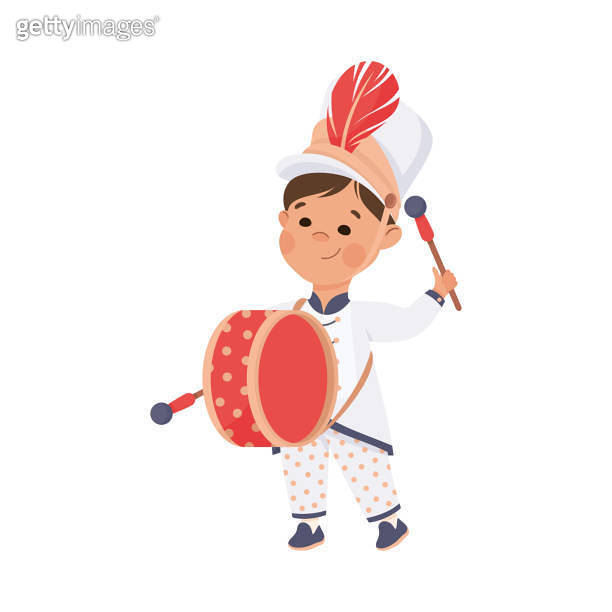 Cute boy in white traditional costume playing drum musical instrument ...
