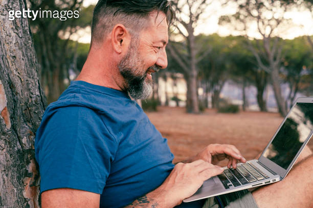 People working outdoor at the park in open air nature office workplace ...