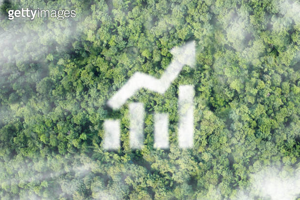 Cloud of a rising graph in the middle of untouched nature symbolizing ...