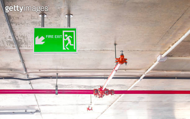 Security green emergency exit sign with red fire protective water ...
