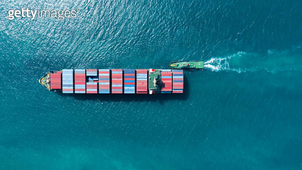 Cargo container Ship with Tug Boat, cargo maritime ship with contrail ...