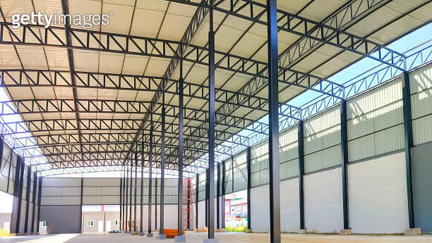Corrugated steel roof with metal roof beam and columns of new warehouse ...