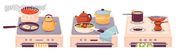 Kettles and pots on the kitchen stove. Cooking food. Gas and electric ...