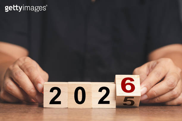 Flipping of 2025 to 2026 on wooden cubes for preparation of new year ...