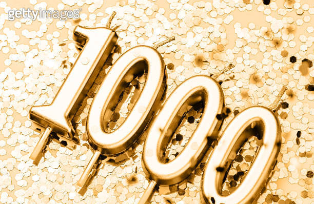 Happy 1000 celebration festive background made with golden candles in ...