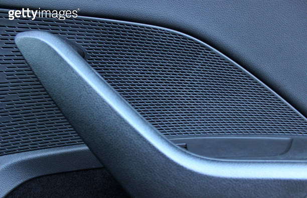 Different textures of plastic panels of the door in the car interior ...