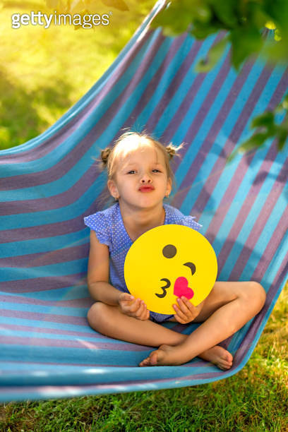 Lady put lips together in kiss, repeating after emoticon sending air ...