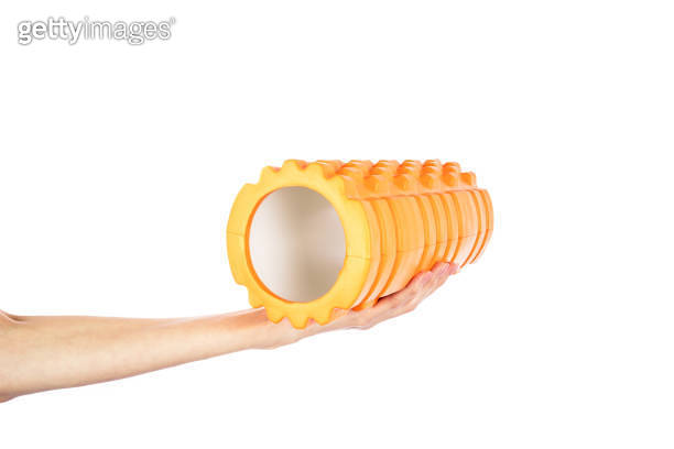 Foam roller for massage of muscle and fascia isolated on white ...
