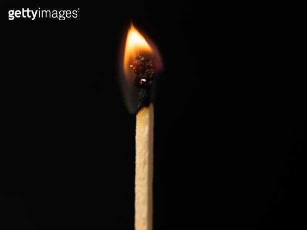 Burning match on a black background. Flame from a lit match. 이미지 ...