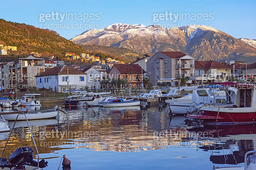 Fishing boats in harbor. View of Marina Kalimanj in Tivat city in ...