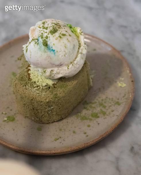 sweet dessert with snow on top, matcha sprinkled all over the dessert ...