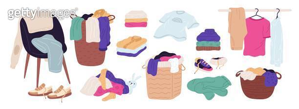 Clothes in piles and stacks. Laundry baskets with t-shirts, panties and ...