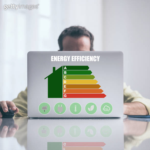 Man calculating energy buildings efficiency class. Ecological and bio ...