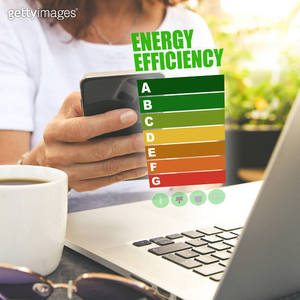 Woman calculating energy buildings efficiency class. Ecological and bio ...