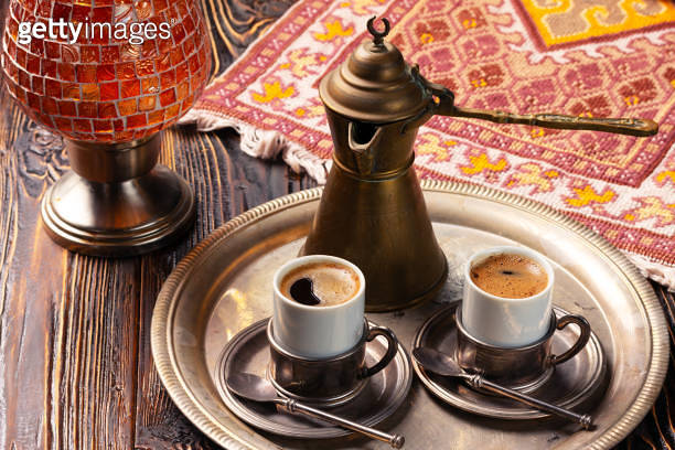 still life with a middle eastern coffee set, on wooden table ...