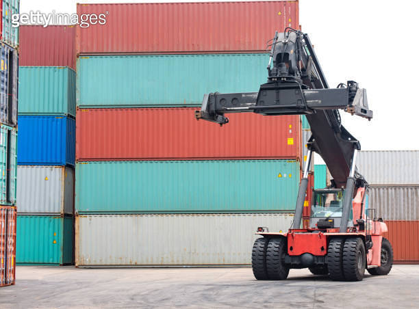 Reachstacker handling loading Containers At Industrial Port And ...