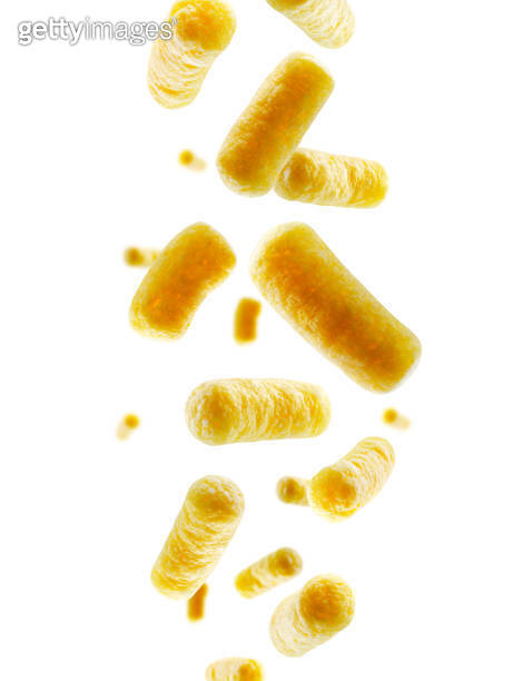 Corn sticks fall in space. Volumetric light from behind. Isolated on ...