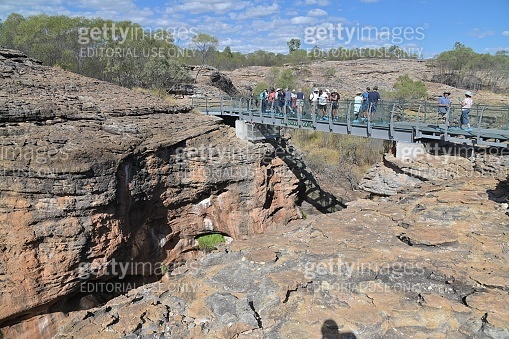 Tourist group cross over a bridge Cobbold Gorge Queensland Australia ...