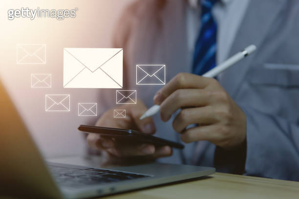 Businessman sending a letter from a smartphone Receiving and sending ...