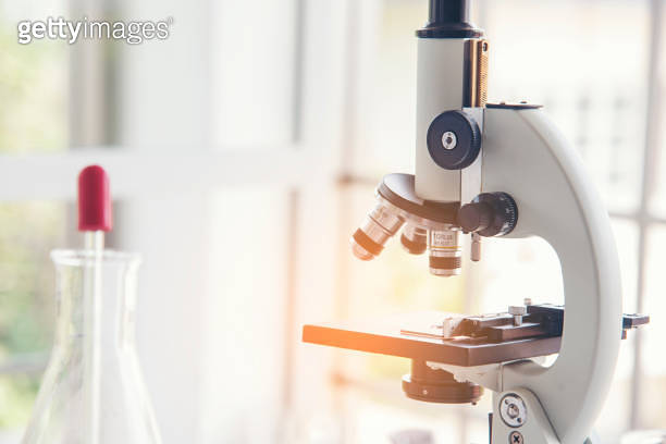 Science microscope equipment in biology chemical laboratory. Scientific ...