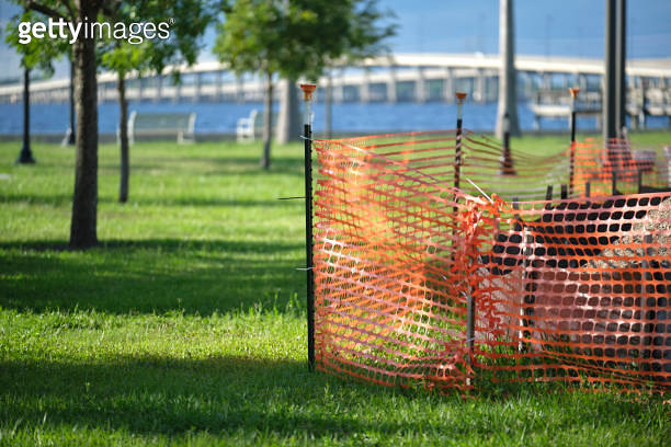 Restriction plastic mesh fence at industrial construction site ...