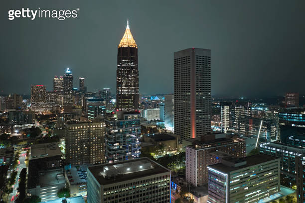 View from above of brightly illuminated high skyscraper buildings in ...