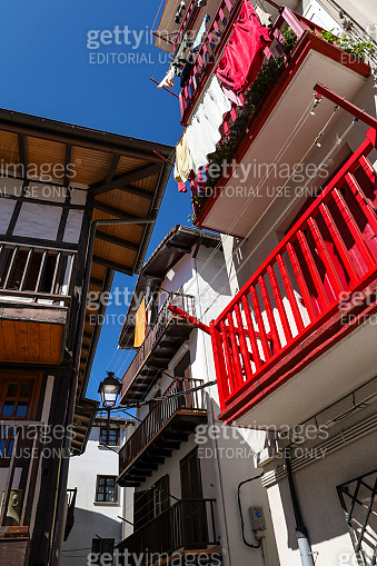 Narrow streets and Traditional and colorful basque houses in the old ...