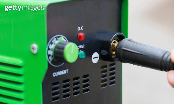 Adjusting the current strength on a modern welding machine. Welding arc ...