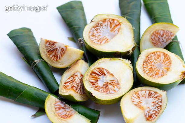 Chewing betel nut, Betel nut with cal lime powder on betel leaves ...