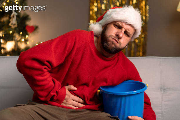 Man suffering from sick stomach and vomiting after Christmas party in ...