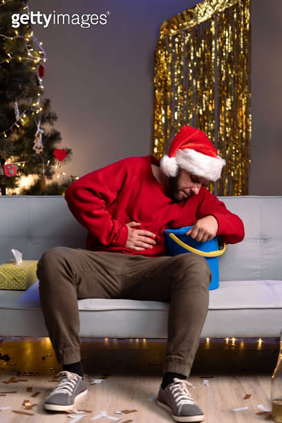 Bearded man suffering from sick stomach and vomiting after Christmas ...