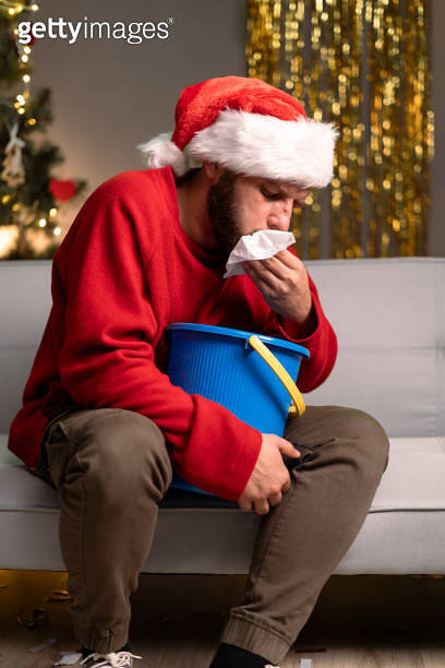 Man suffering from sick stomach and vomiting after Christmas party at ...