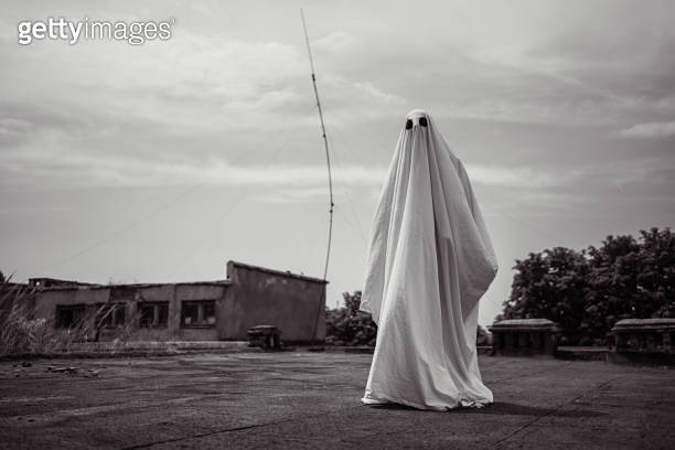 Mystery, magic, Halloween concept. Ghost covered with a white ghost ...