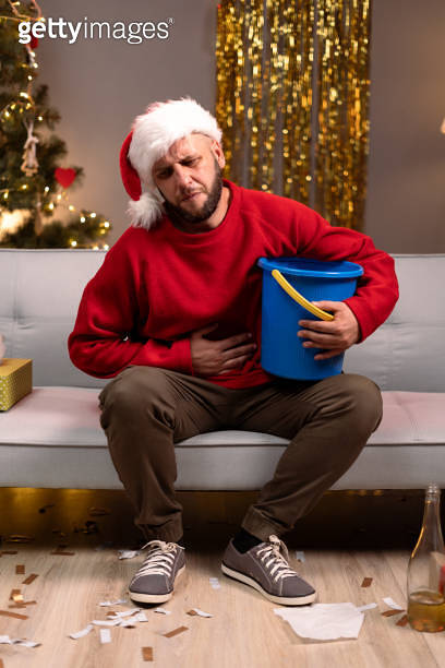 Man suffering from sick stomach and vomiting after Christmas party at ...