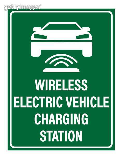 Wireless electric vehicle charging station. Information road sign with ...