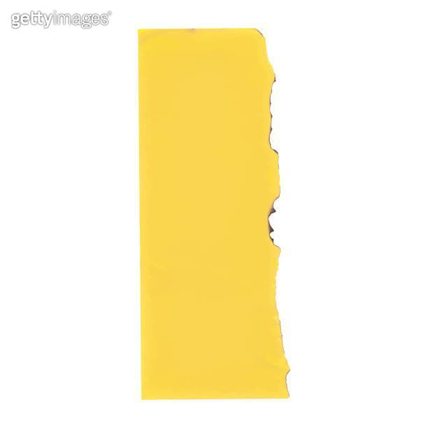 scrap of yellow paper with scorched edges for scrapbooking design ...