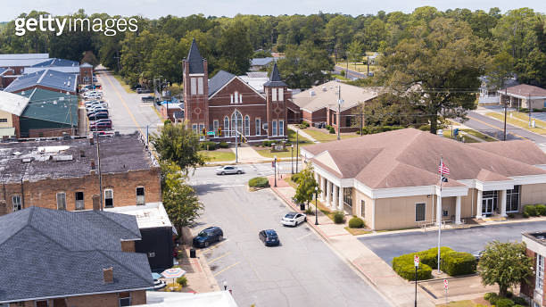 Main street of Pelham neighborhood in Georgia. School buildings ...