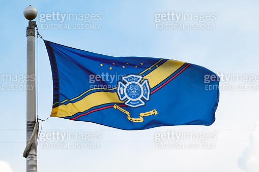 The Calgary fire department flag, with the words: integrity, dedication ...