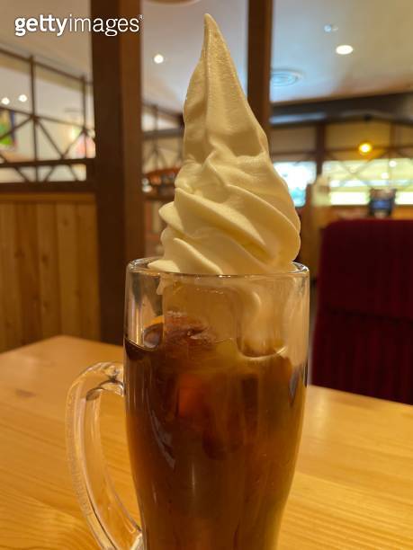 Soft serve ice cream on top of iced coffee. (1753897804) - 게티이미지뱅크