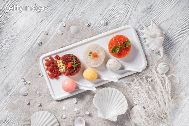 Finely chopped salmon, tuna, squid, ice cream balls, basil, tobiko ...