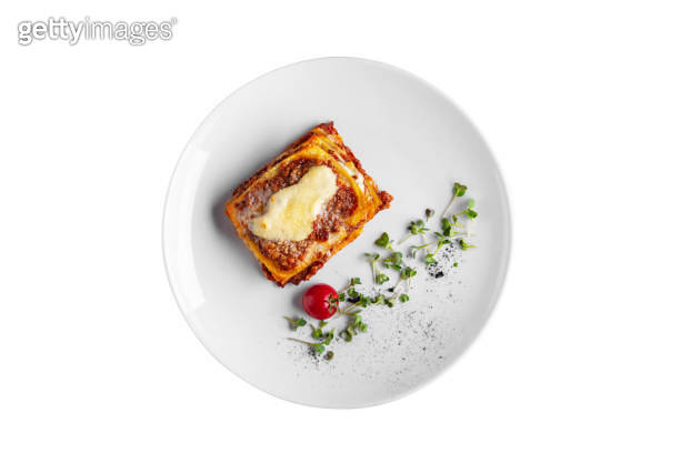Lasagna with cheese, meat, ketchup, puff pastry, tomatoes and mung bean ...