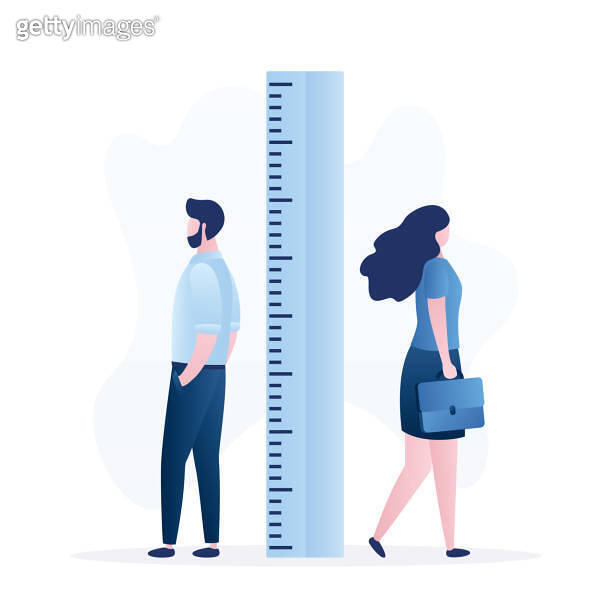 Big ruler measures height of two workers. Colleagues stand near to the ...