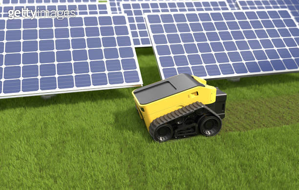 The automatic lawn mower is mowing the grass at the solar panel. 이미지 ...