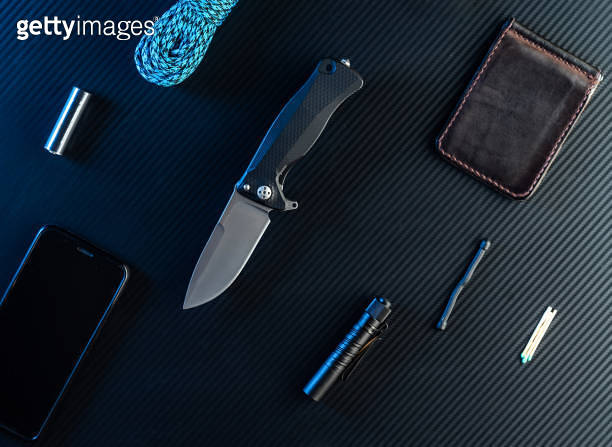 Knifeman's set. Knife and everyday items. Knife, flashlight and wallet ...