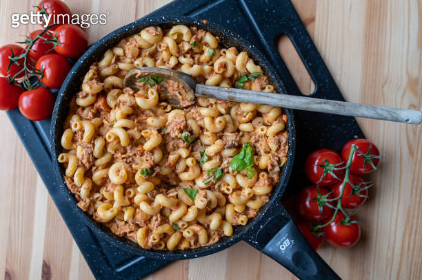 Shell noodles with creamy tuna in a skillet. One Pot meal (1849886041 ...