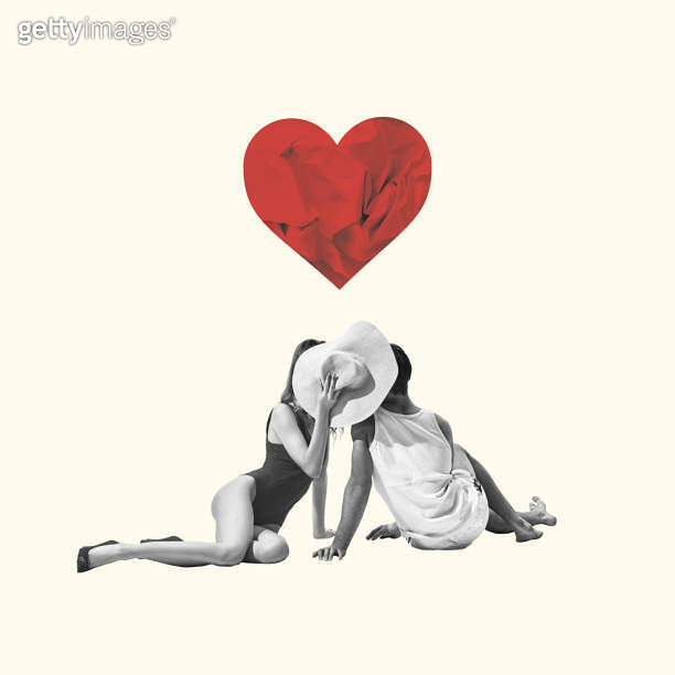 Summer romance. Man and woman cissing behind straw hat over heart ...