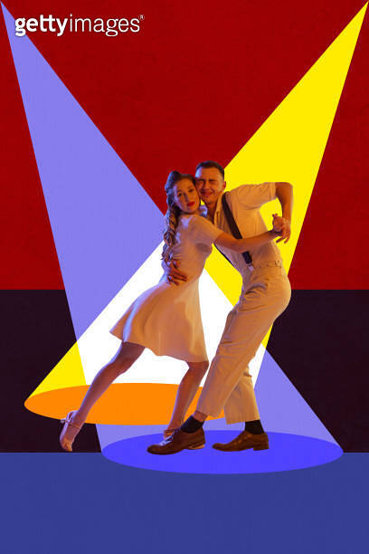 Young people, man and woman in stylish clothes dancing retro dance over ...