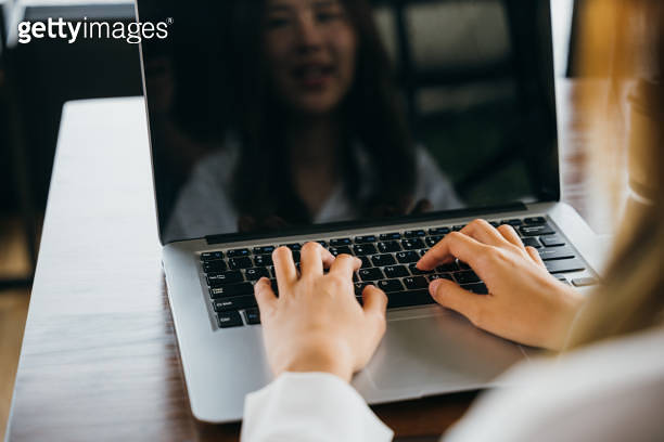 Happy beautiful freelancer blogger typing keyboard on laptop for ...