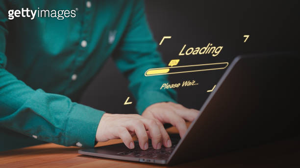 Concept of waiting for load of loading symbol. User man using a laptop ...